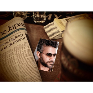 Your picture on the playing cards next to newspaper